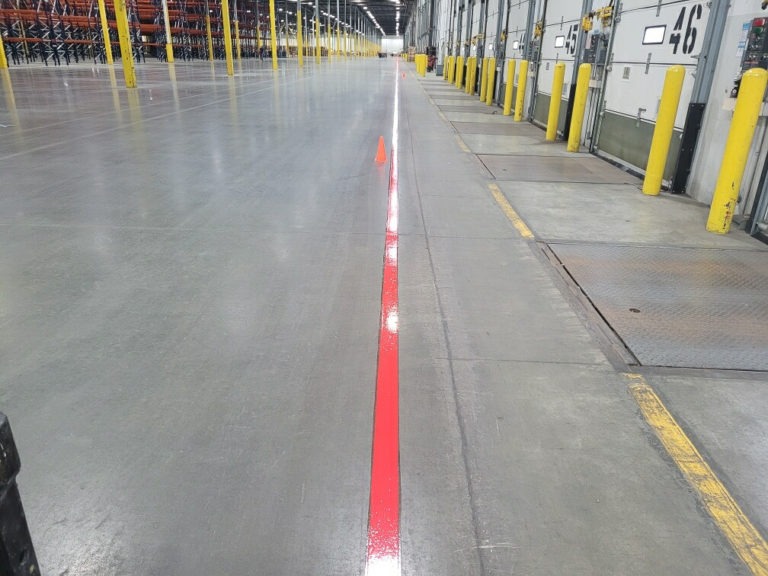 Installing Egress Walkway Lines at a Distribution Facility – PennCoat Inc.